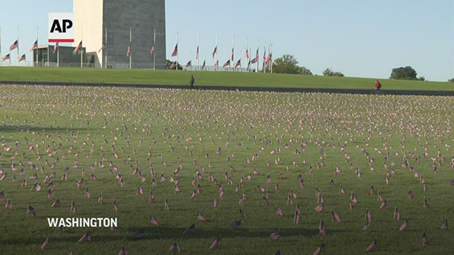 Flags planted in DC to mark grim coronavirus milestone | khou.com