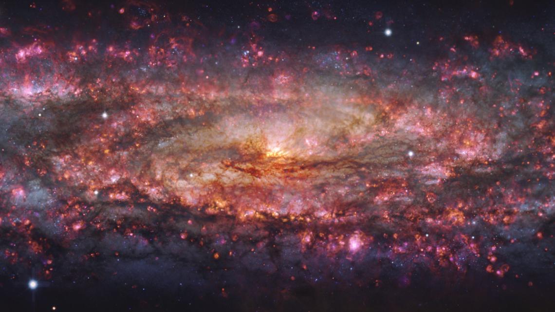 Astronomers unveil dazzling Sculptor galaxy image | khou.com