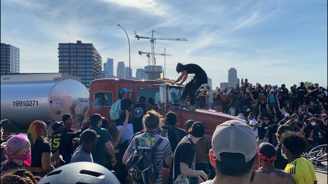 Semi driver arrested after barreling into protesters on I-35W | khou.com