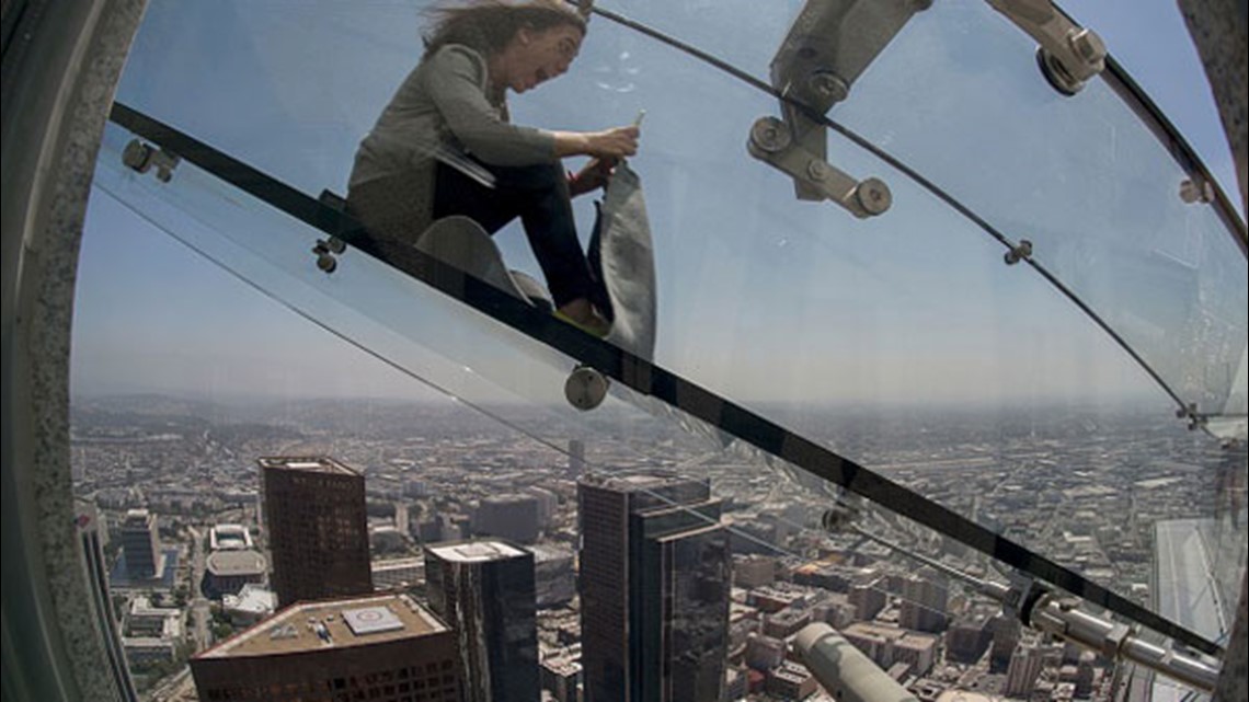 WATCH: Taking a ride on a 1,000-foot-high glass skyslide | khou.com