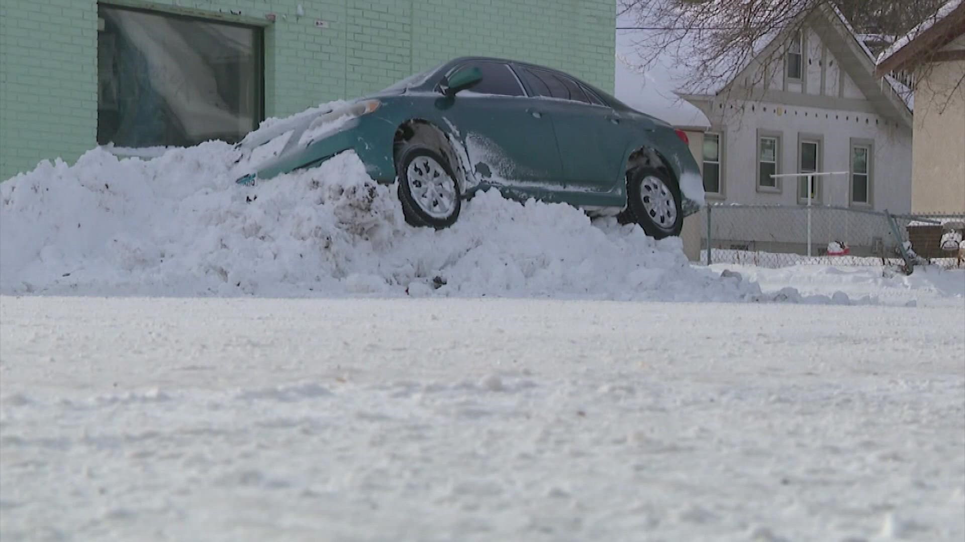 How did this car get stuck on a pile of snow in Minneapolis? | khou.com