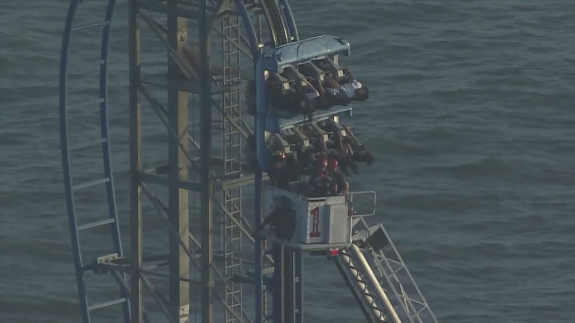 Iron Shark roller coaster car lowered to ground after Galveston rescue ...
