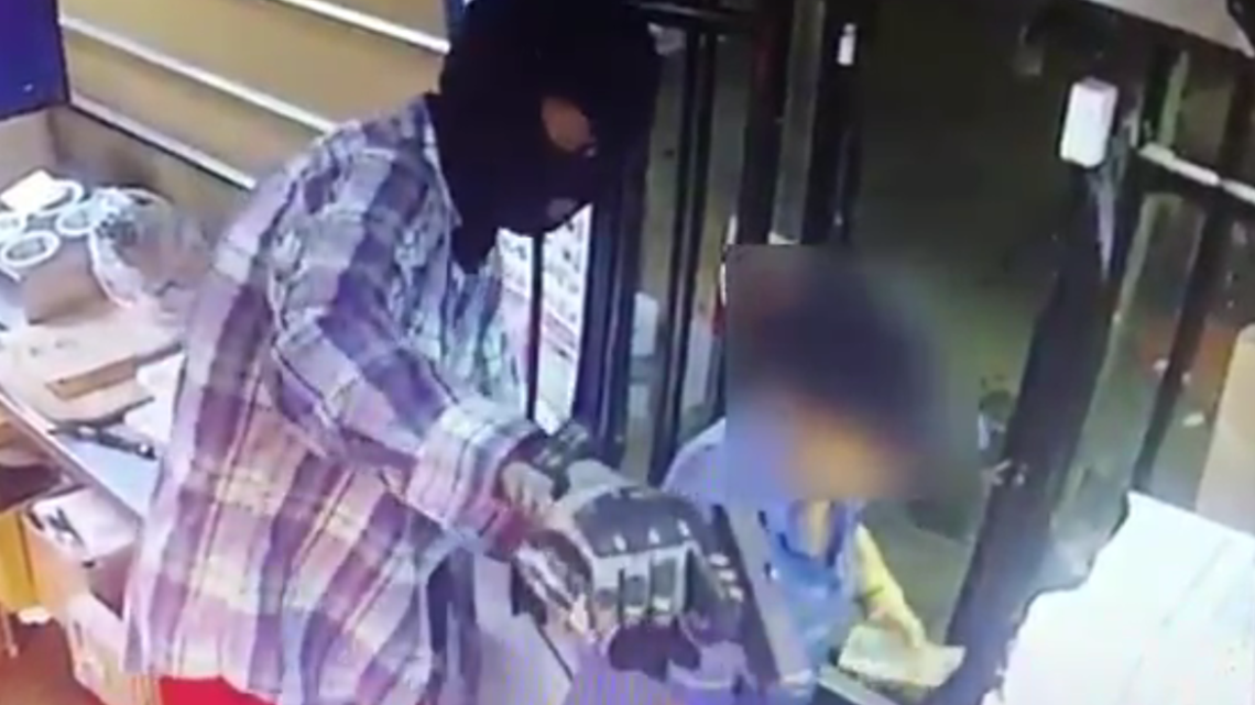 Caught on camera: Masked man robs Church's Chicken at gunpoint | khou.com