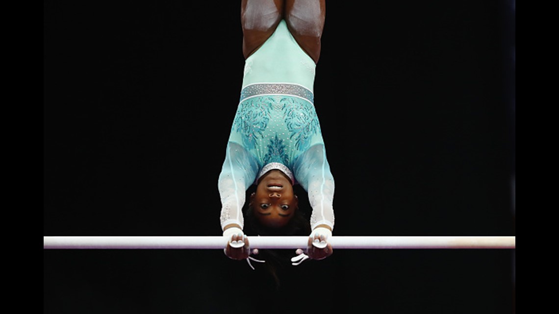 Simone Biles makes history as first woman to win four all-around world ...