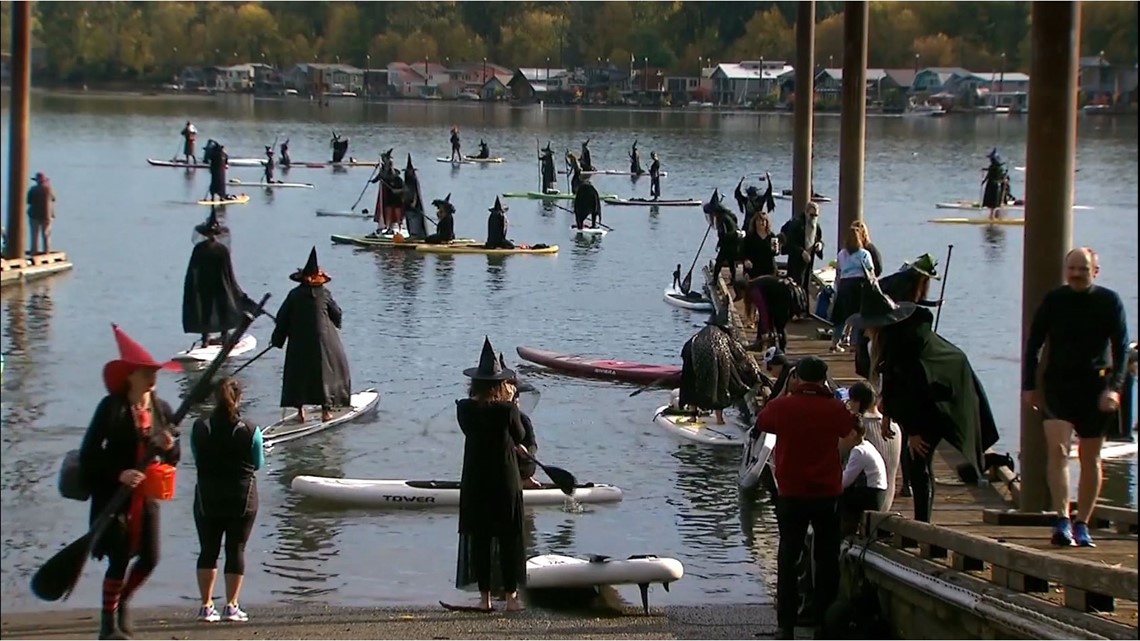 Hundreds of witches seen paddleboarding down river in Portland | khou.com