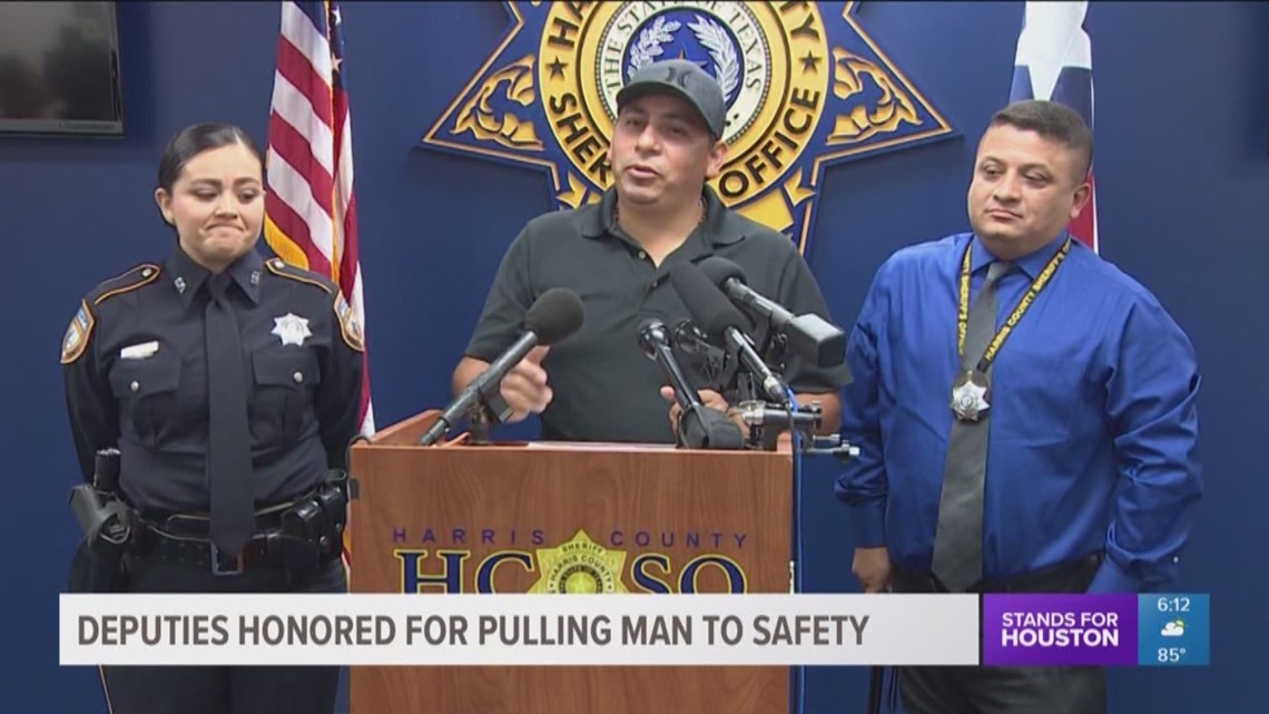 HCSO deputies honored for saving man hanging off overpass | khou.com