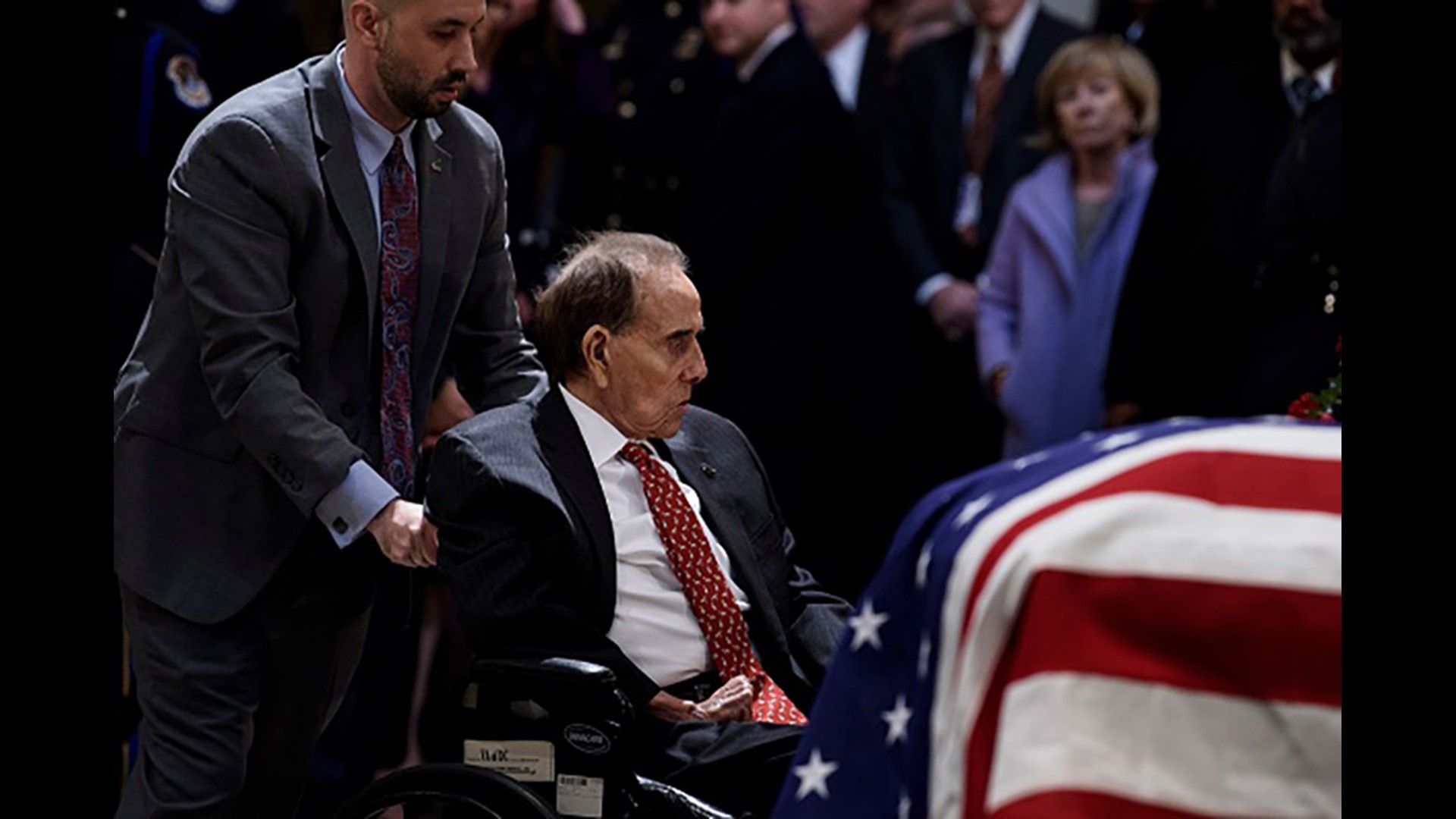 Greatest Generation: Frail Bob Dole salutes fellow hero Bush 41 | khou.com