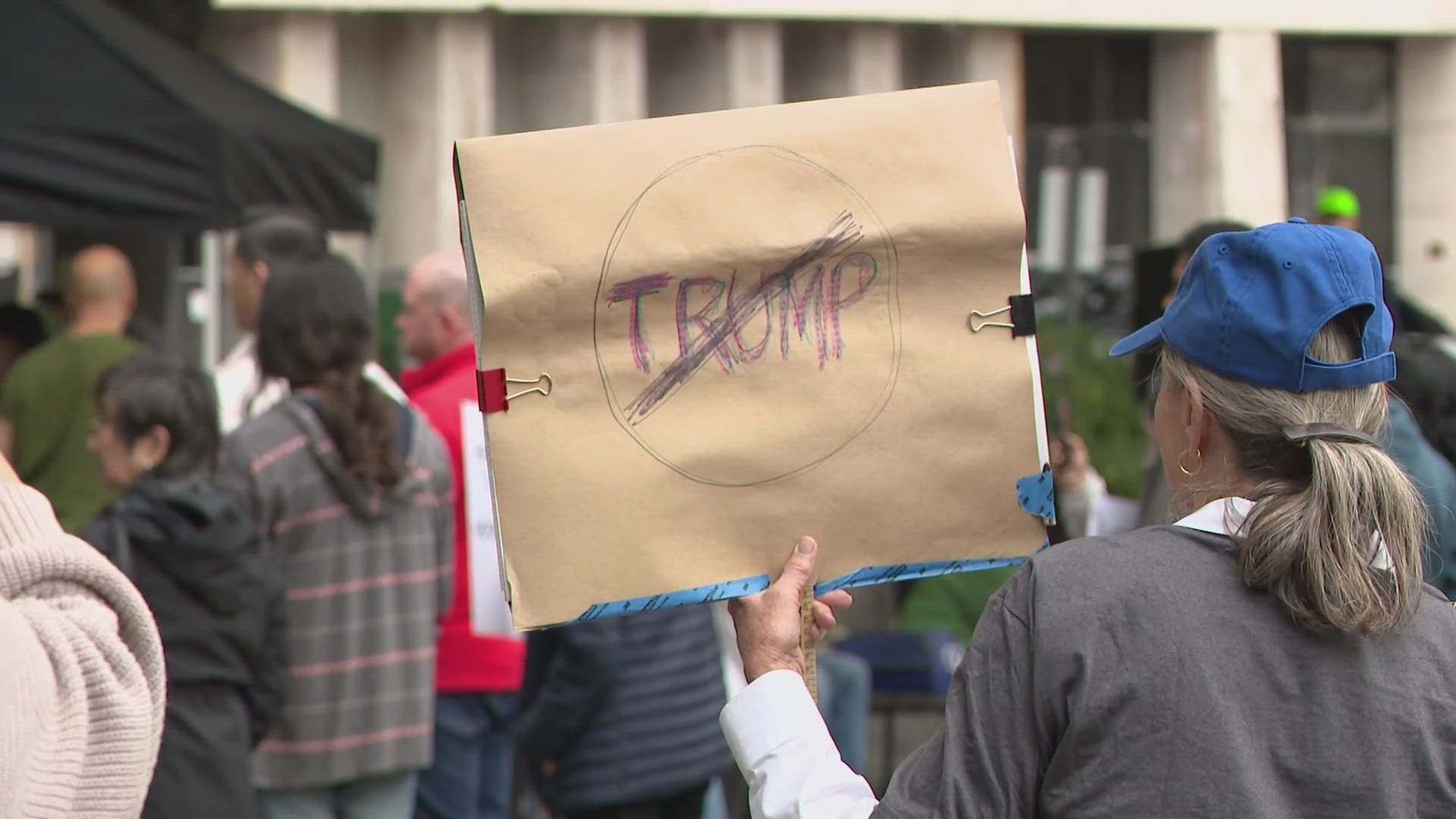 Hundreds walk out in downtown Houston to protest Trump, mark ...