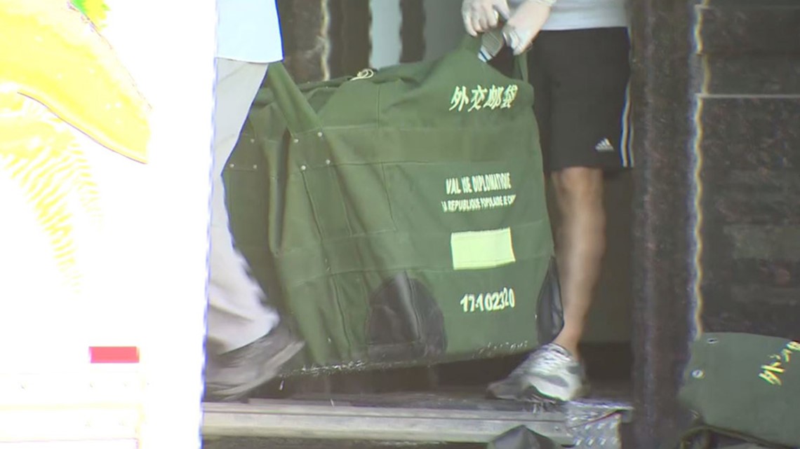 Chinese consulate fire, eviction: Houston workers load duffel bag ...