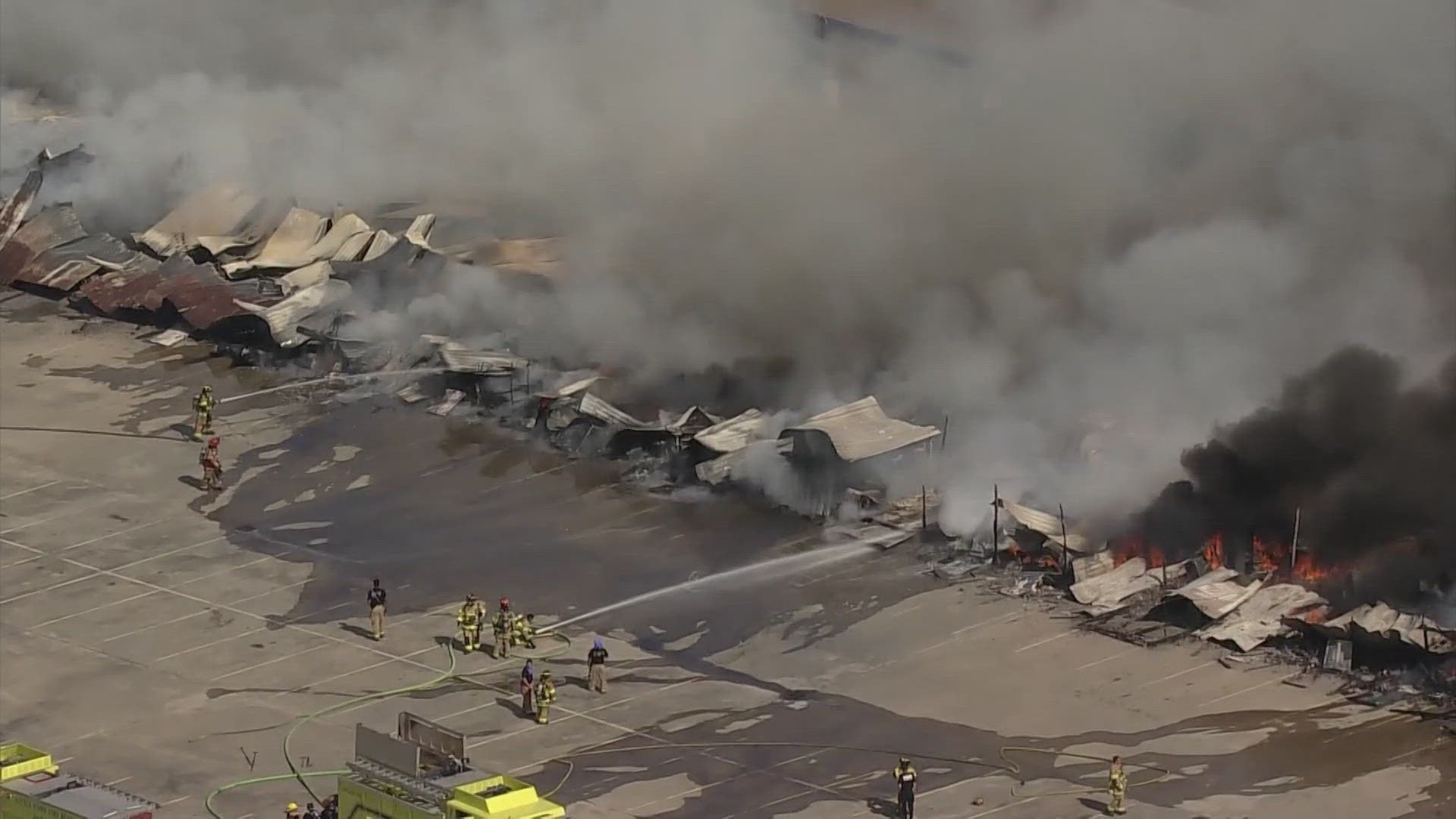 Firefighter injured as crews battle building fire at flea market in N ...