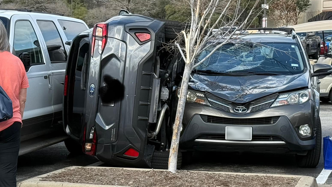Car ends up wedged between two vehicles in H-E-B parking lot in the ...
