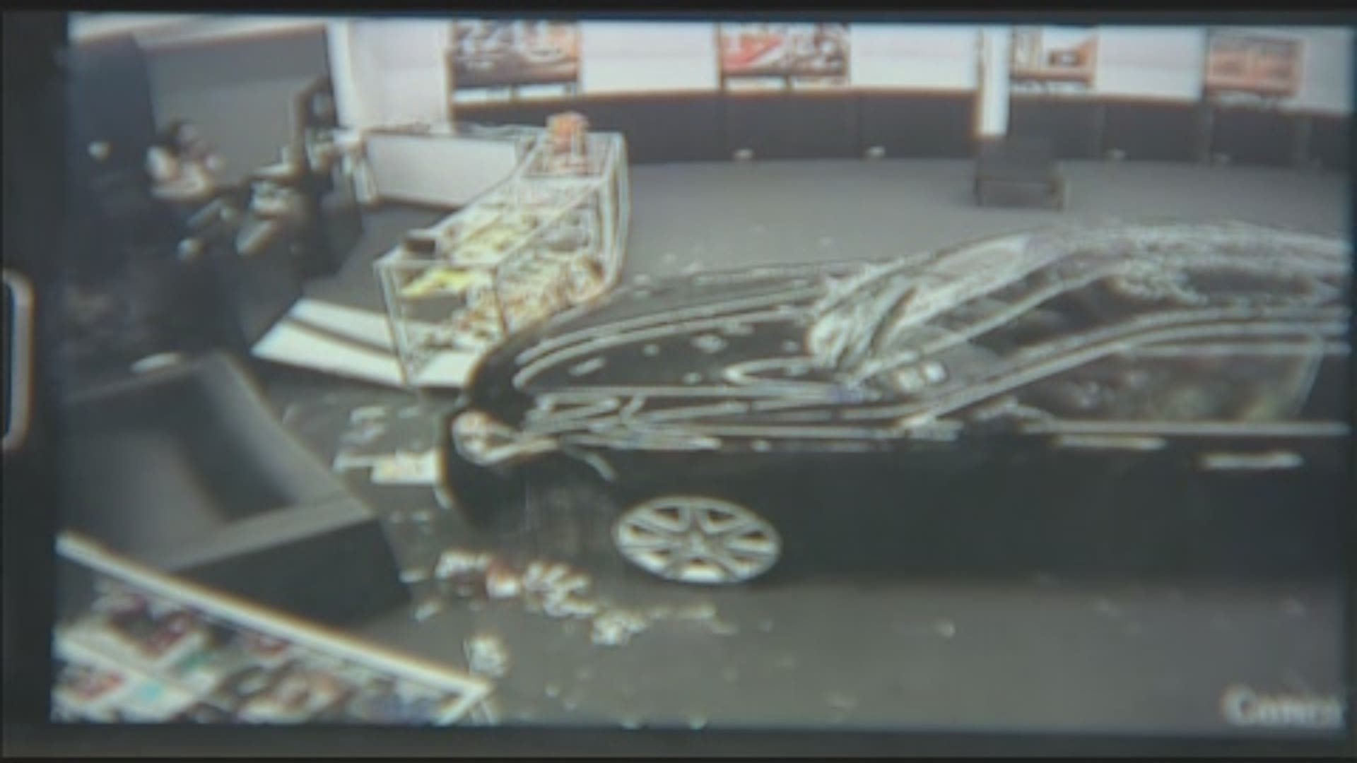 Raw video: Car crashes into cell phone store | khou.com
