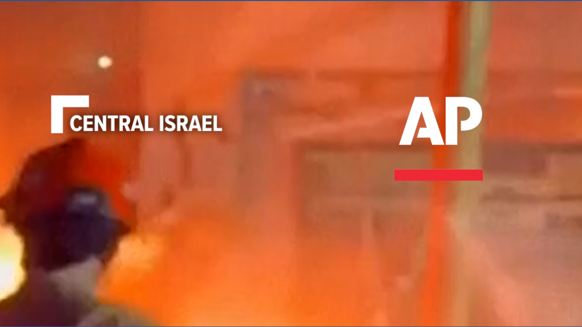 Cars on fire as Israeli emergency services respond to projectile hit ...