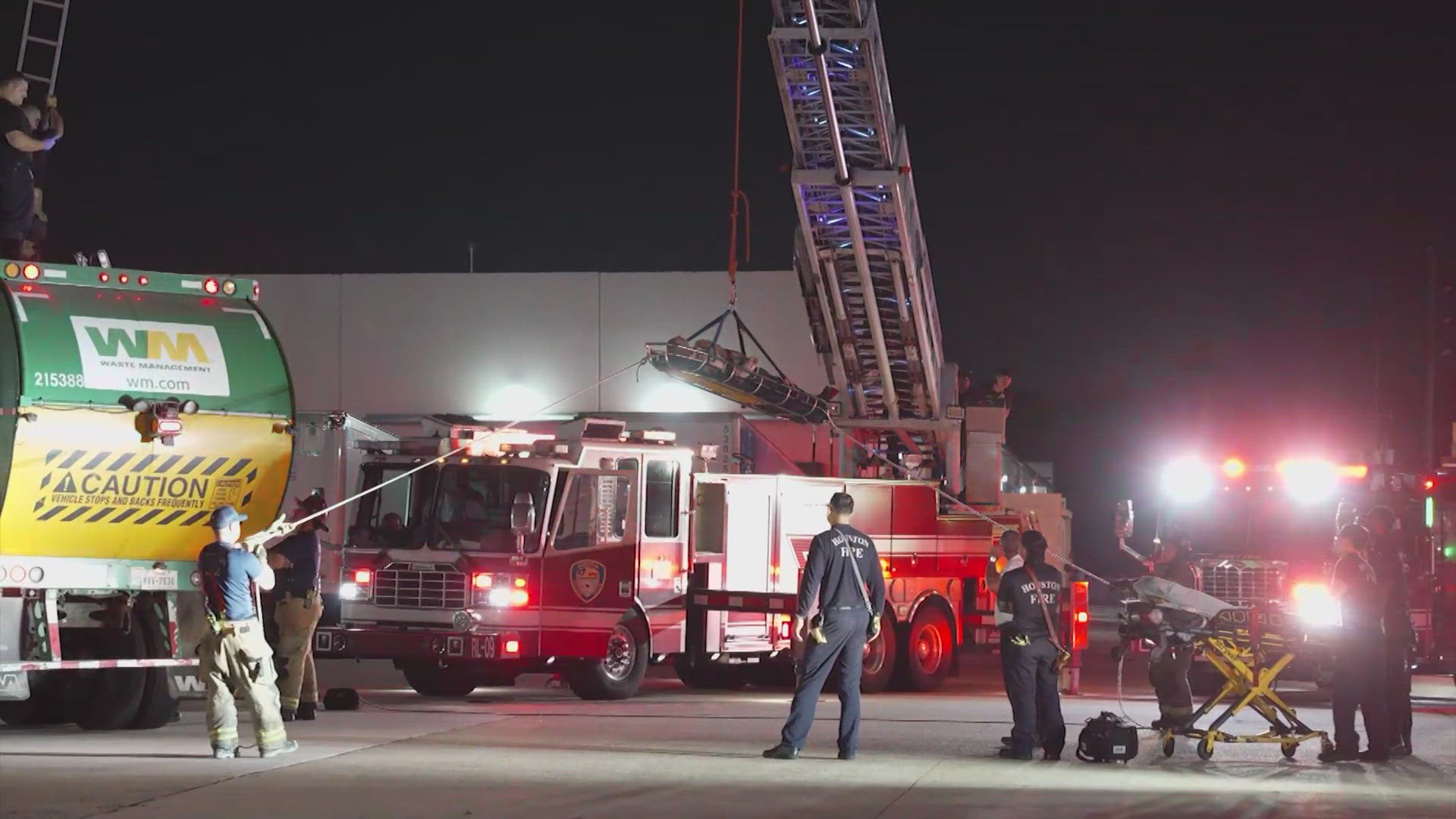 Man rescued after getting stuck in back of garbage truck in west ...