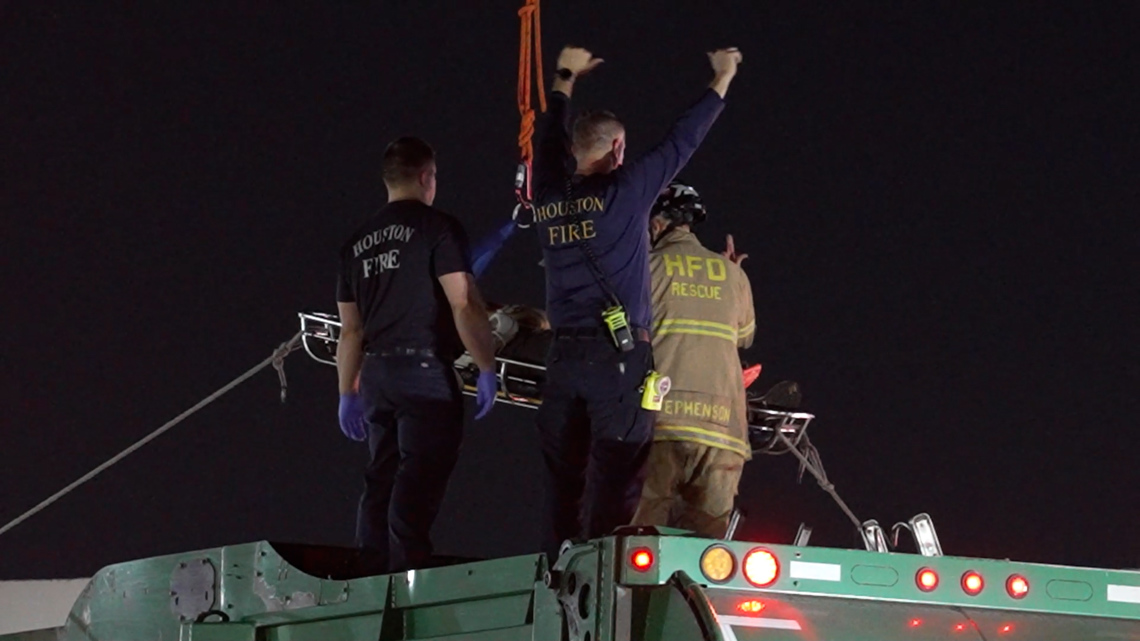 Man rescued after getting stuck in back of garbage truck in west ...