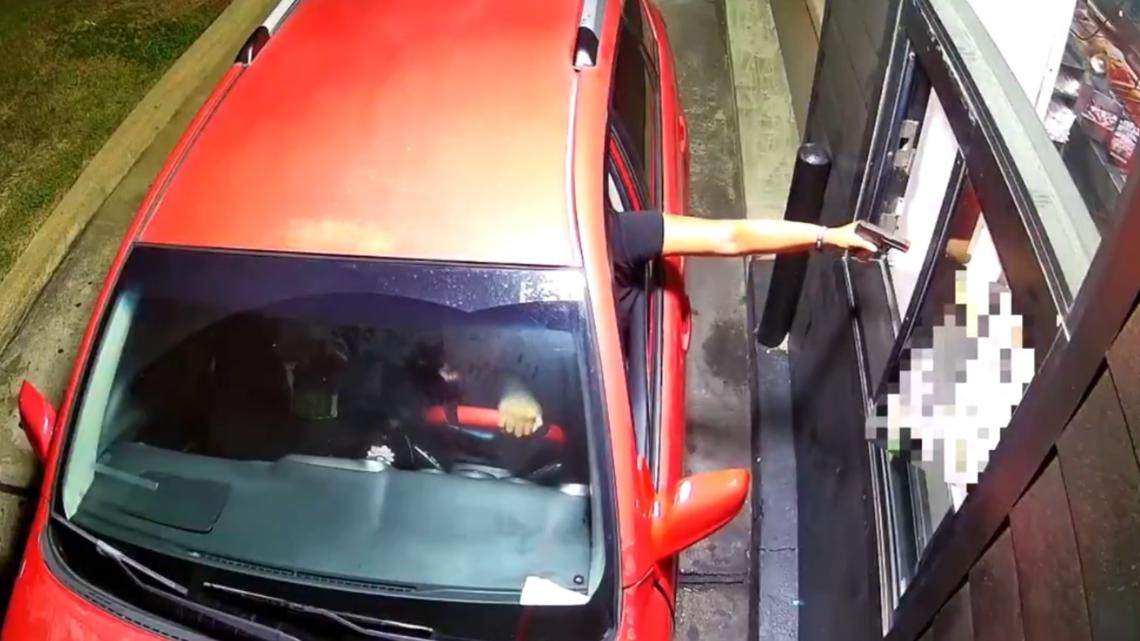 Woman seen on video pulling gun on fast-food drive-thru worker | khou.com