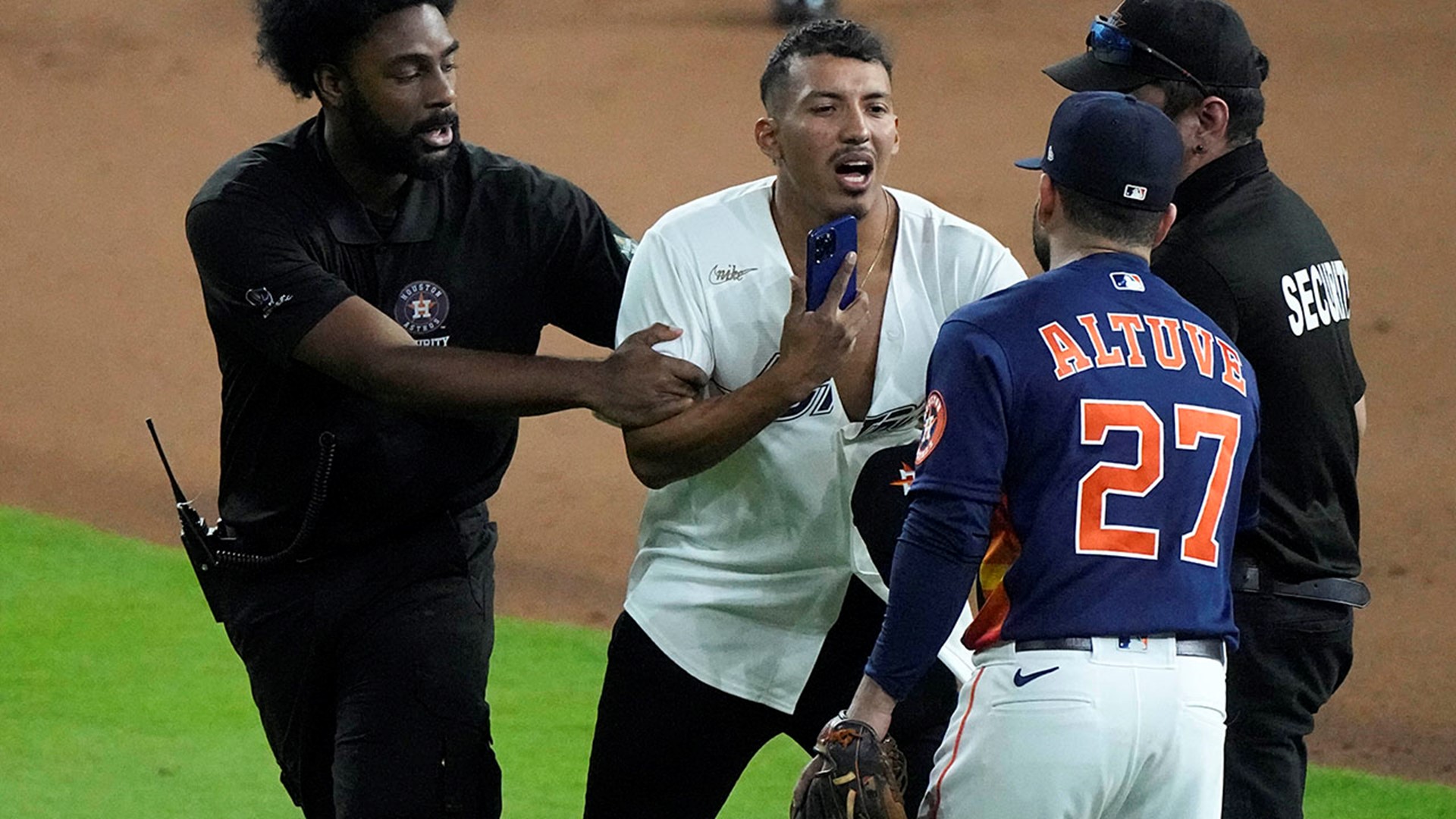 Fan runs on field during ALCS Game 2 to hug Jose Altuve | khou.com