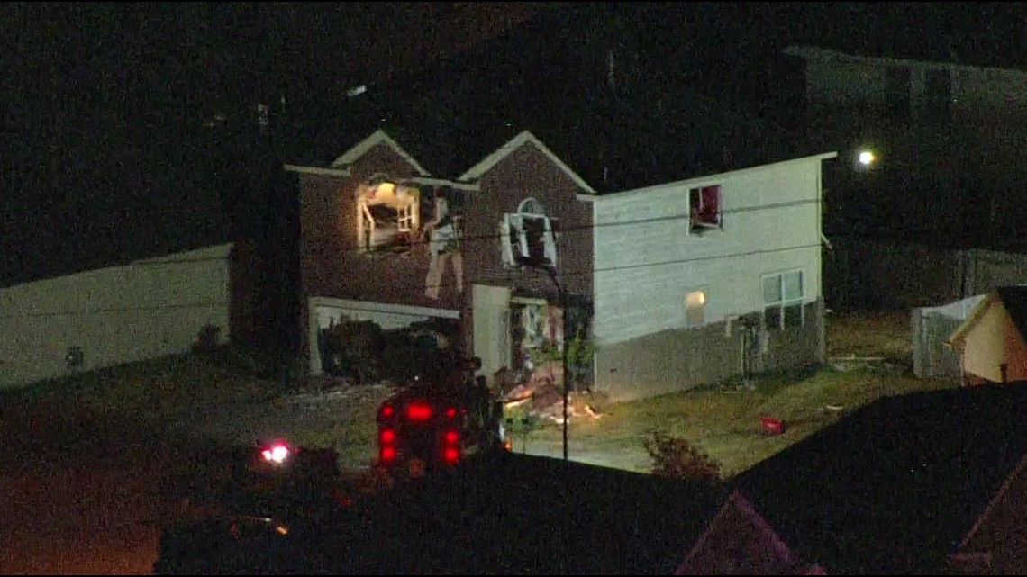 Law enforcement uses equipment to tear down home with barricaded ...
