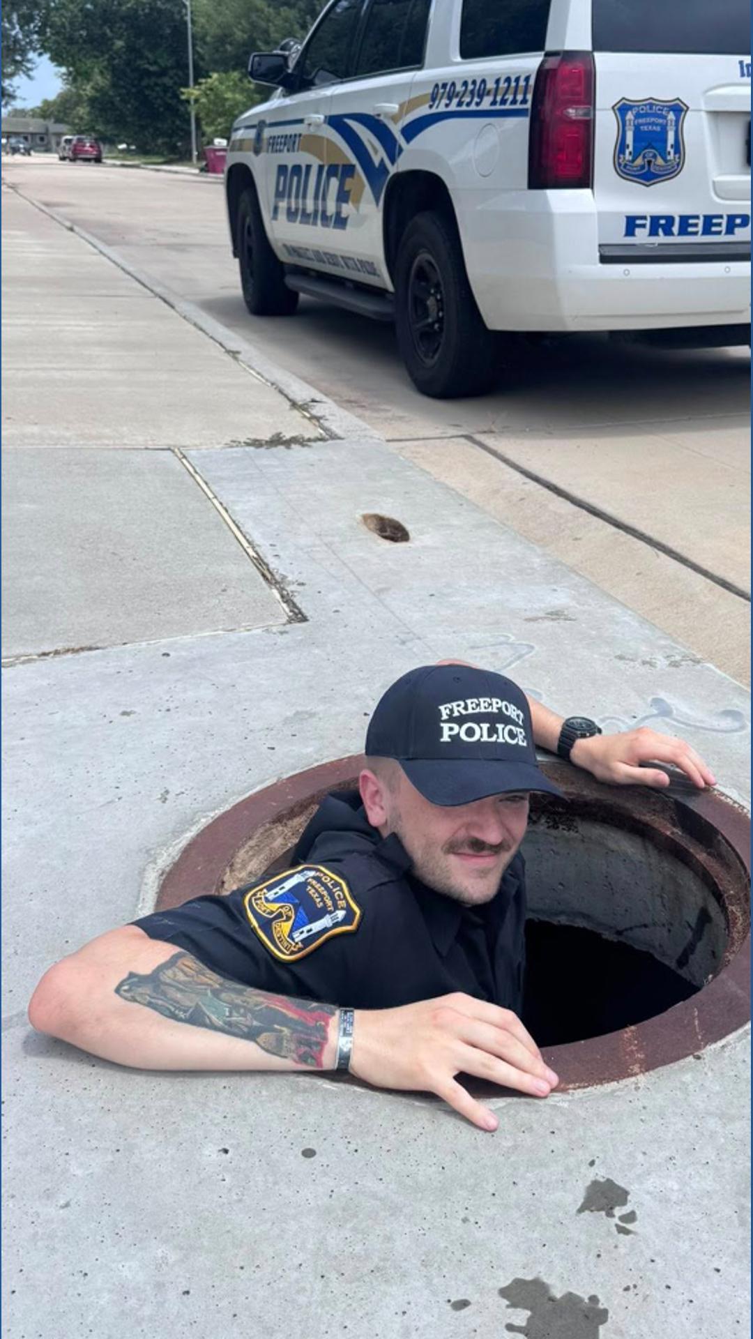 Freeport police officer saves kitten from storm drain | khou.com