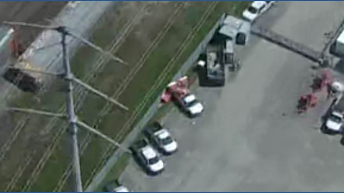 Several train cars derail and lean over Houston road, forcing closure ...