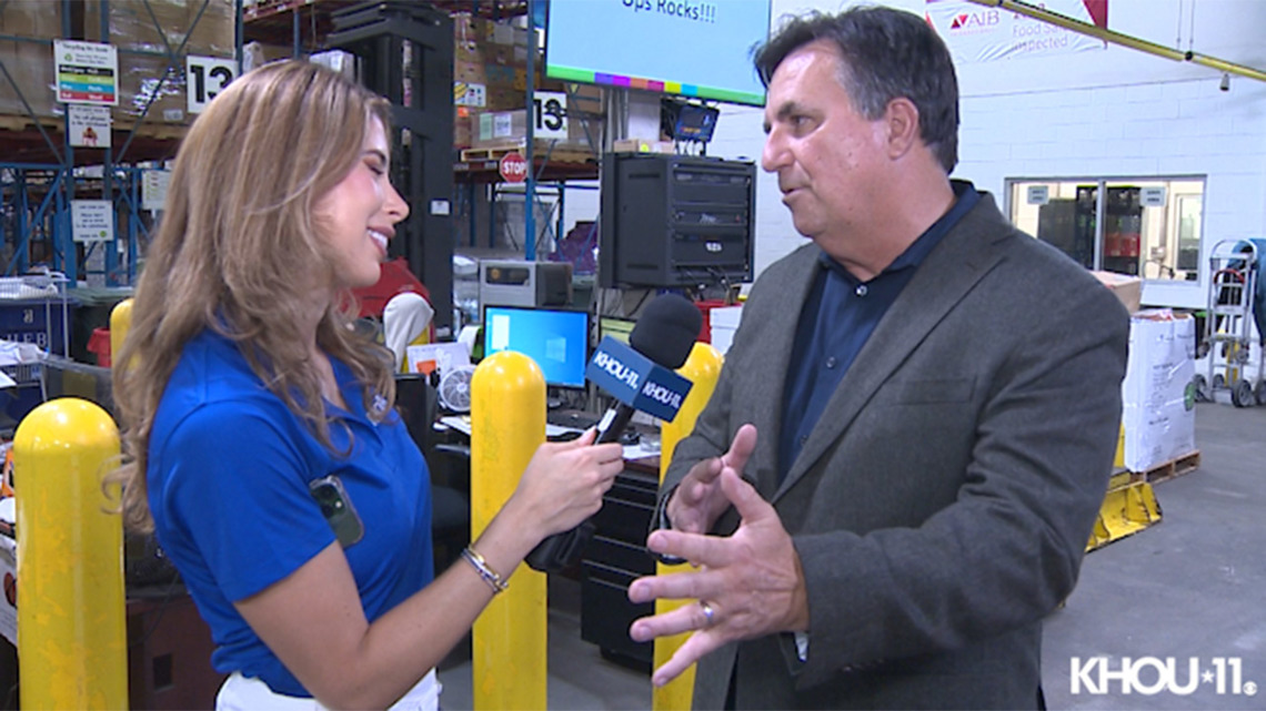 Brian Greene, president of the Houston Food Bank gives meteorologist ...