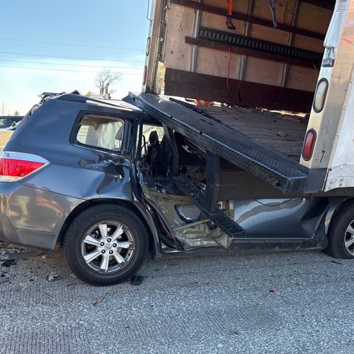 Women rescued from vehicle trapped under box truck on Highway 290 ...