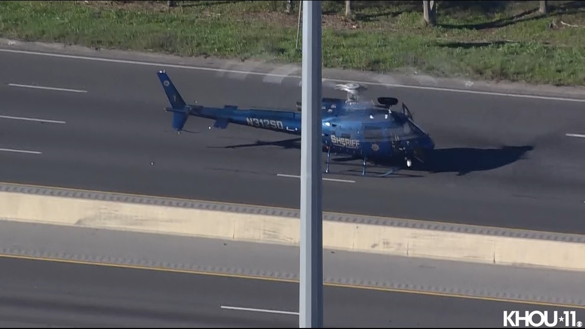 Police helicopter lands on Houston's East Freeway during standoff ...