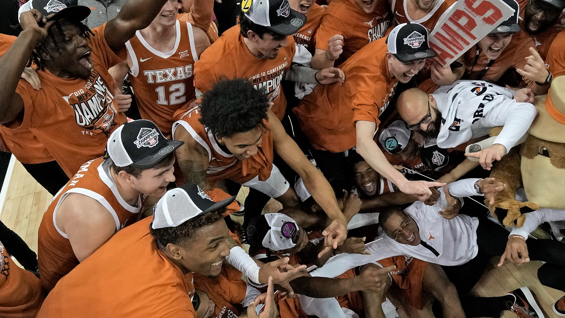 Texas Longhorns players mob coach Rodney Terry after Big 12 title ...