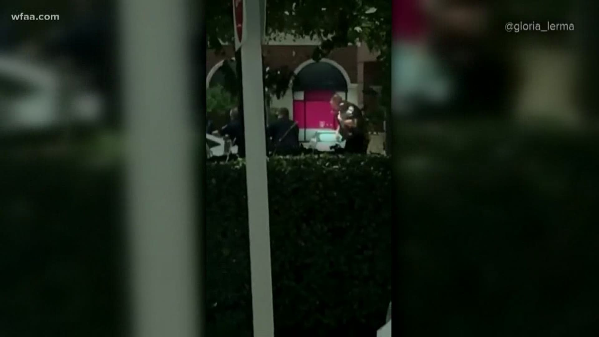 Cops rescue baby from woman accused of dousing bank lobby in gas during ...